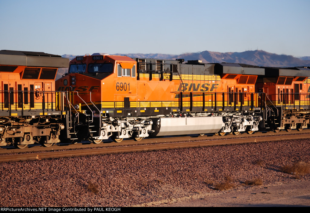 With the Sun shining off Her BNSF/GE Swoosh Logo Paint BNSF 6901heads east with a Z train.